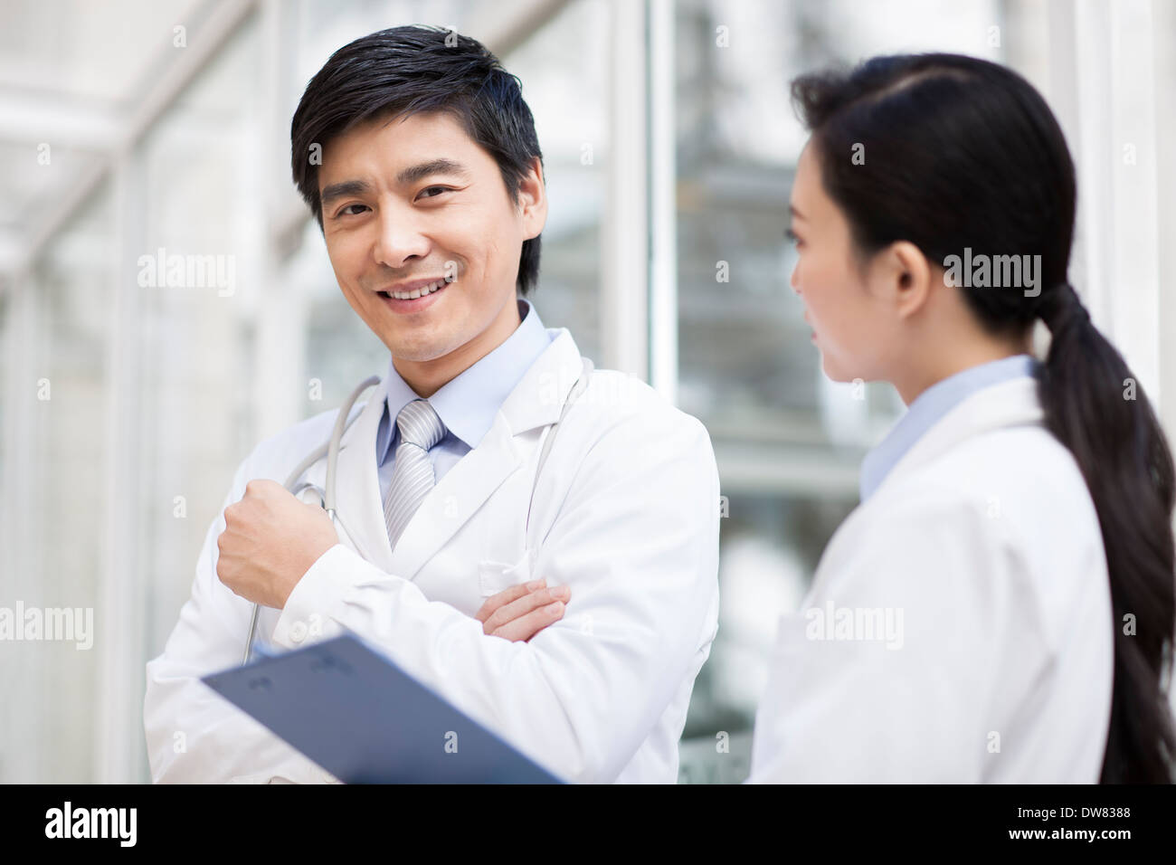 Happy doctors smiling Stock Photo - Alamy