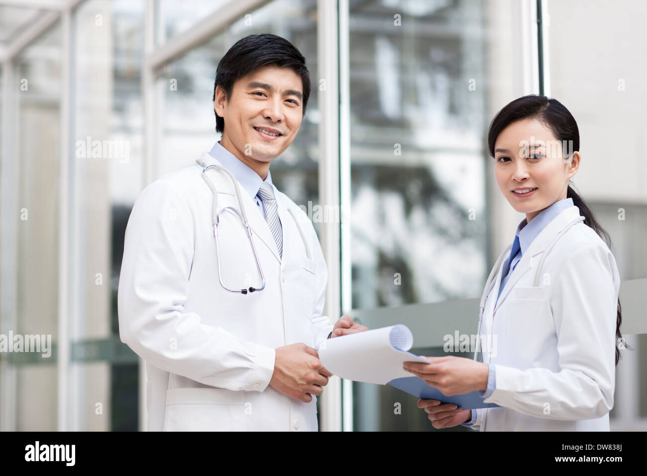 Happy doctors smiling Stock Photo - Alamy
