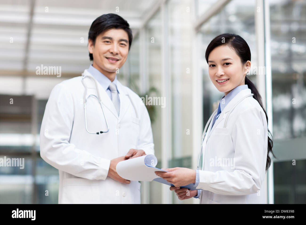 Happy doctors smiling Stock Photo - Alamy