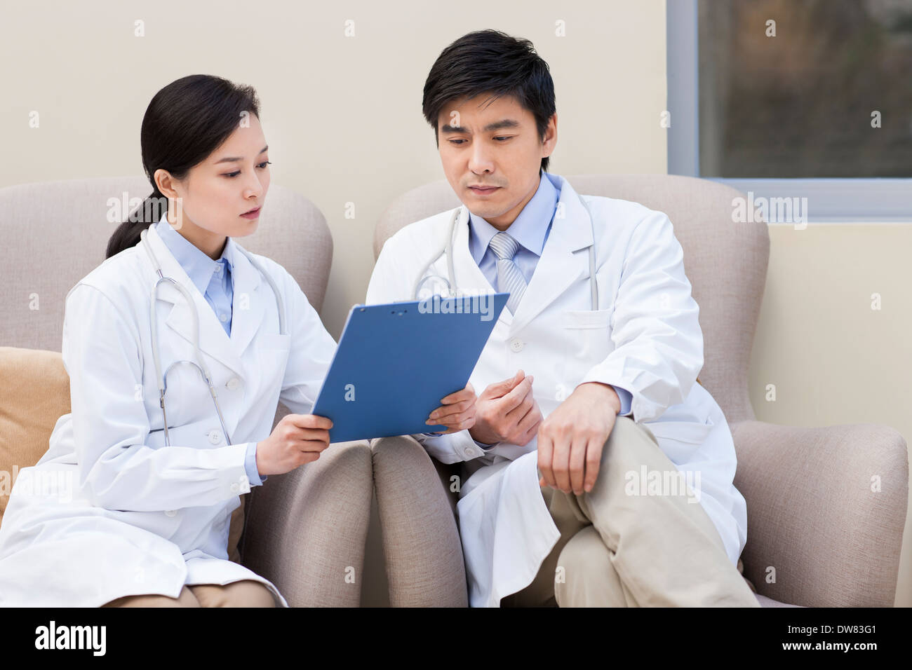 Serious discussion two office close hi-res stock photography and images ...