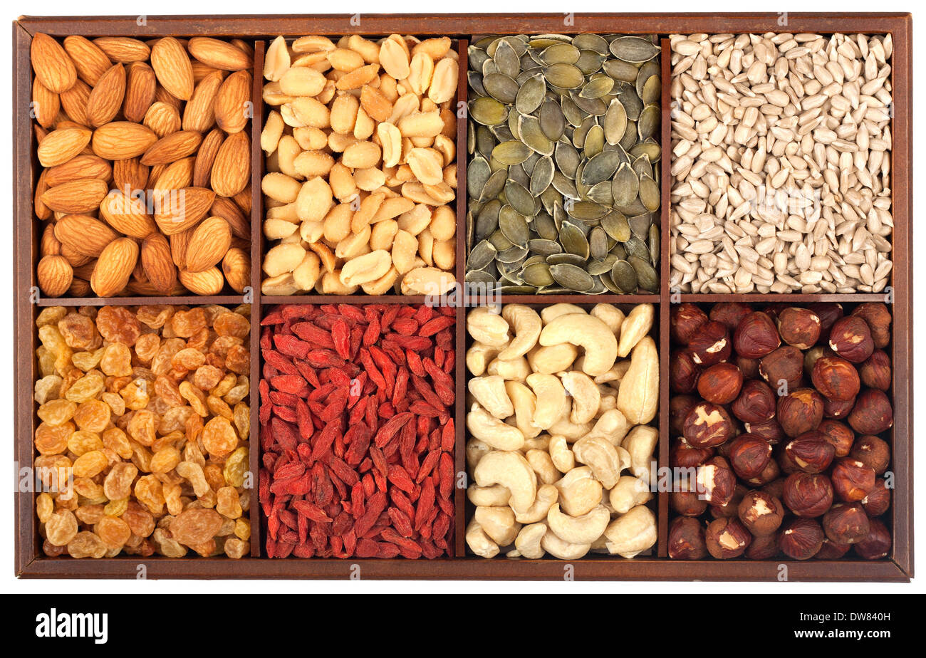 Healthy food organic nutrition.Wooden box full of raw seeds and nuts ...