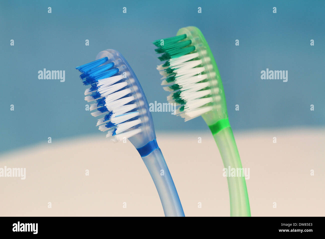 Blue and green toothbrushes Stock Photo - Alamy