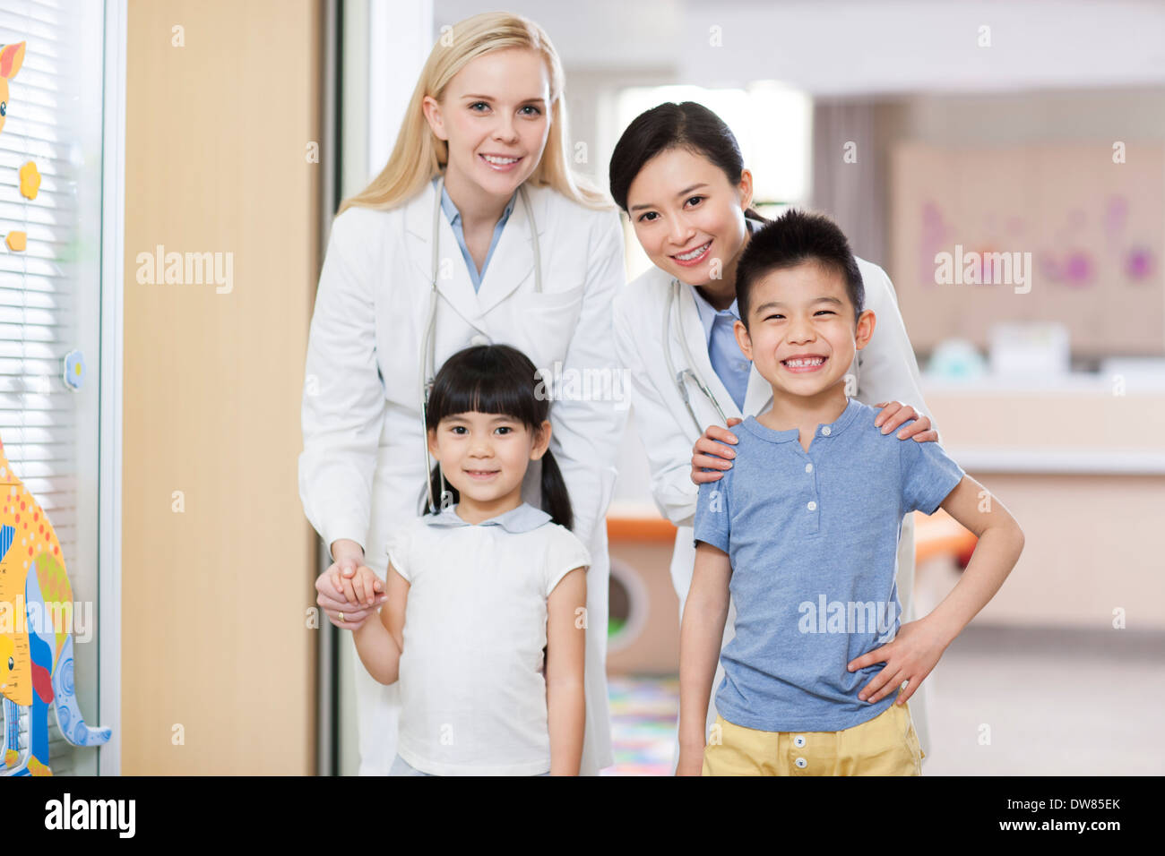 Doctors and kids in children's hospital Stock Photo - Alamy