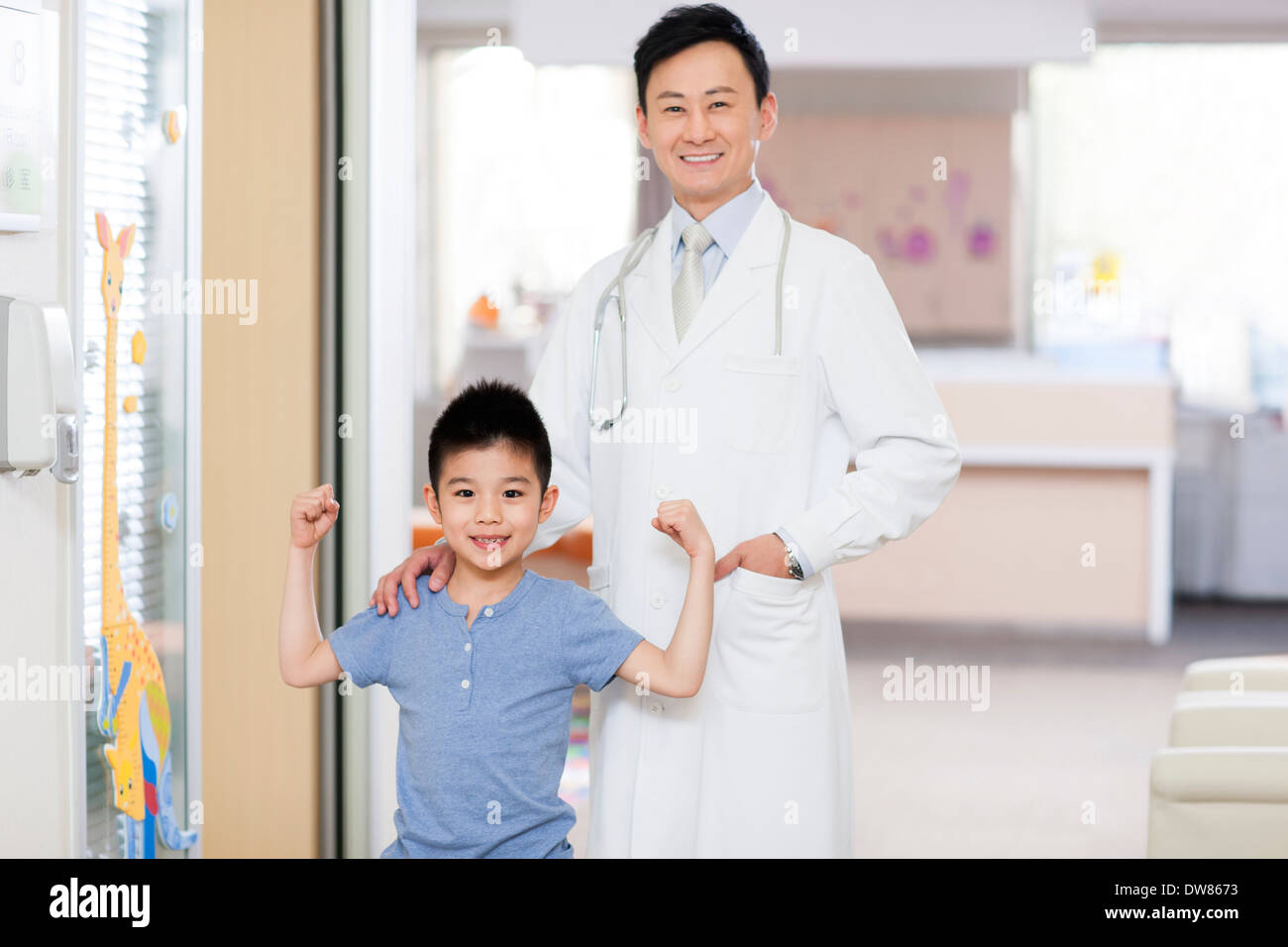 Happy doctor and boy in children's hospital Stock Photo - Alamy