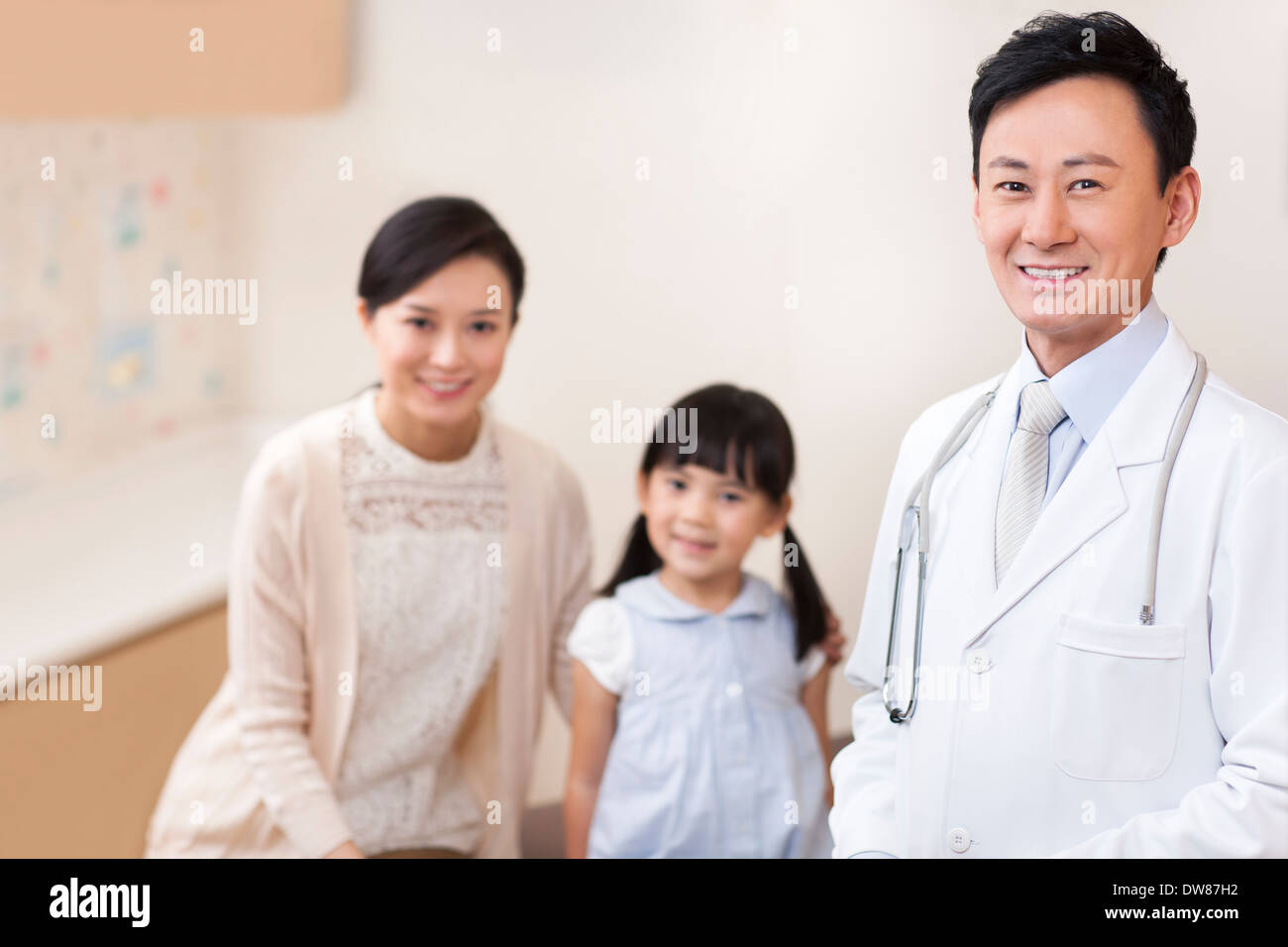 Doctor with girl and young mother in hospital Stock Photo - Alamy
