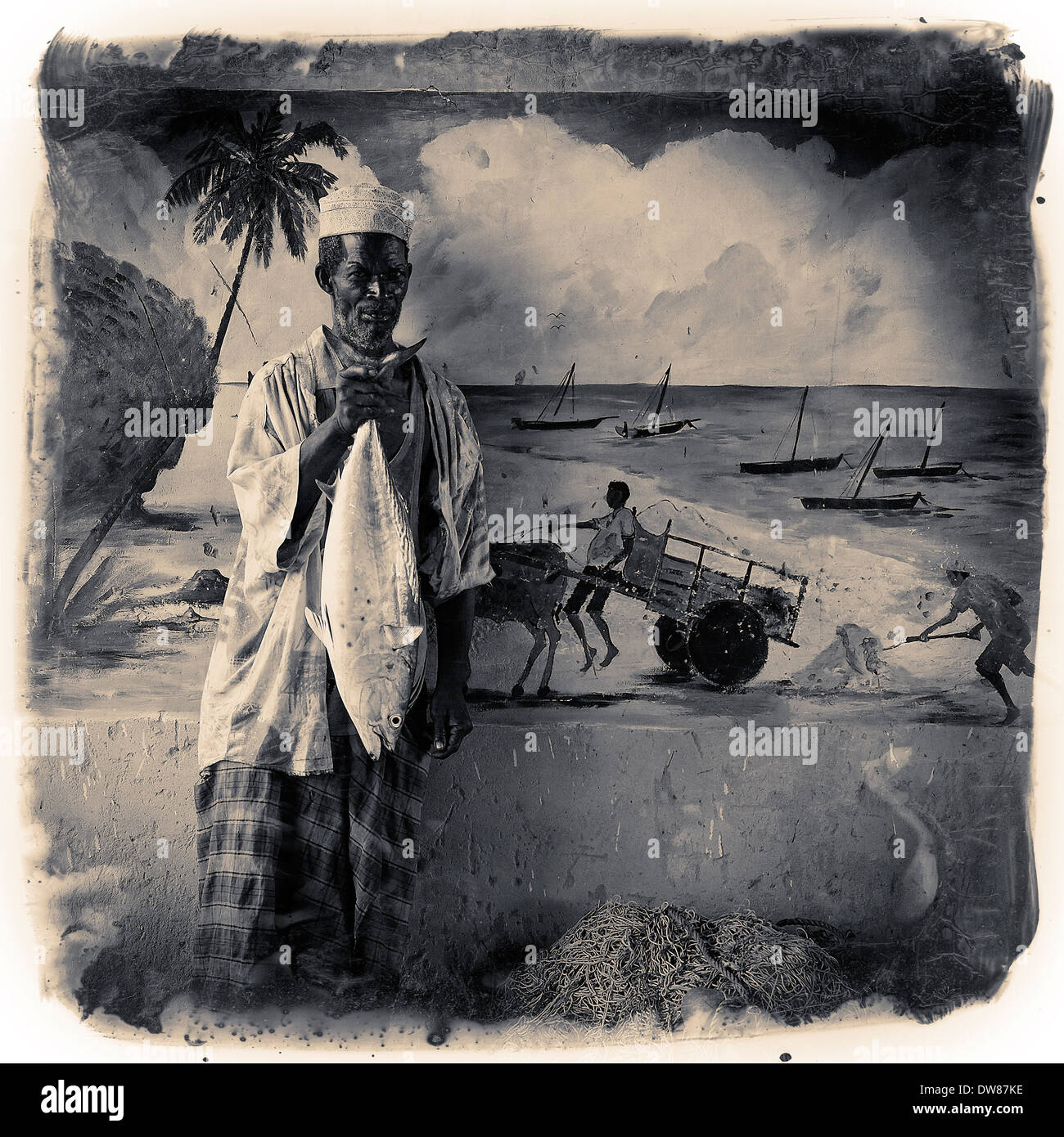 A fishmonger holding a fish in Zanzibar island a semi-autonomous part ...