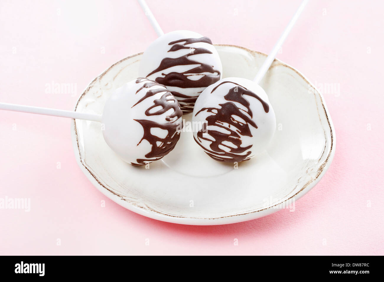 White cake pops decorated with dark chocolateWhite cake pops decorated ...