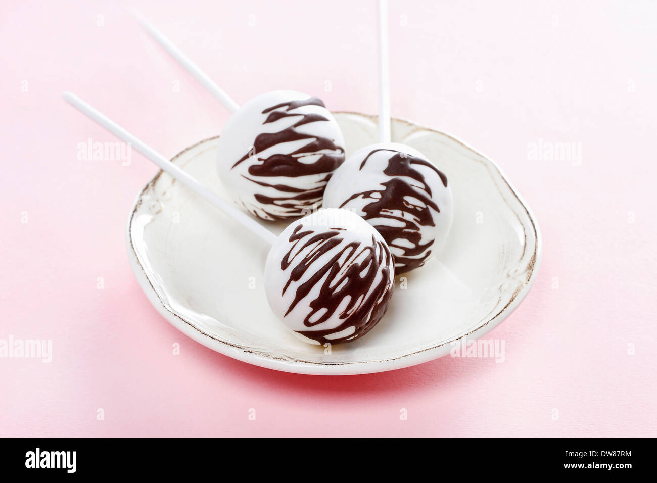 White cake pops decorated with dark chocolateWhite cake pops decorated ...