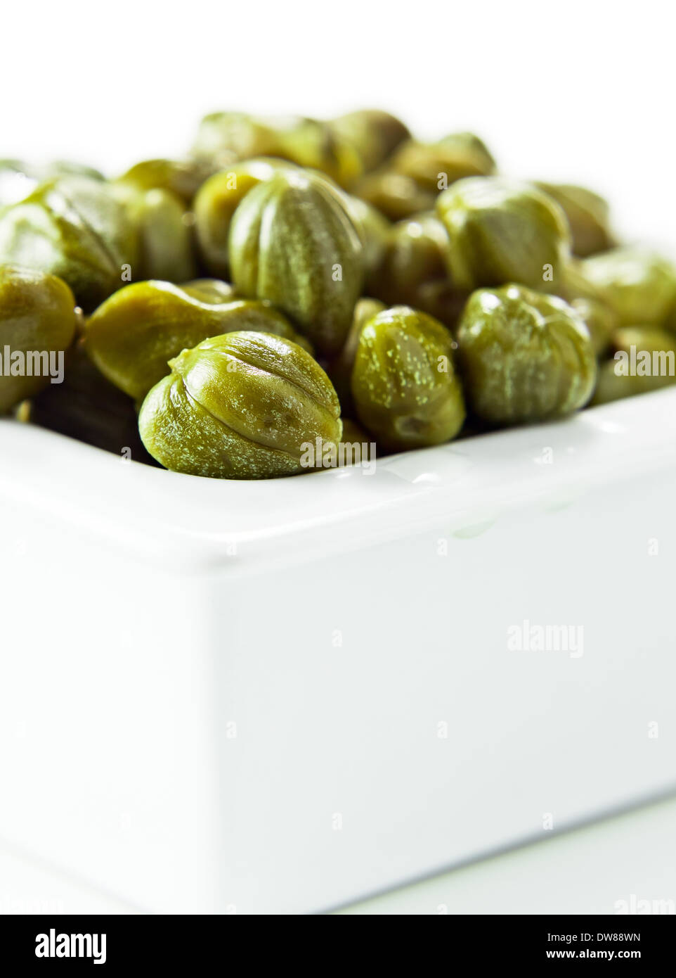 Marinated capers isolated on a white background Stock Photo - Alamy
