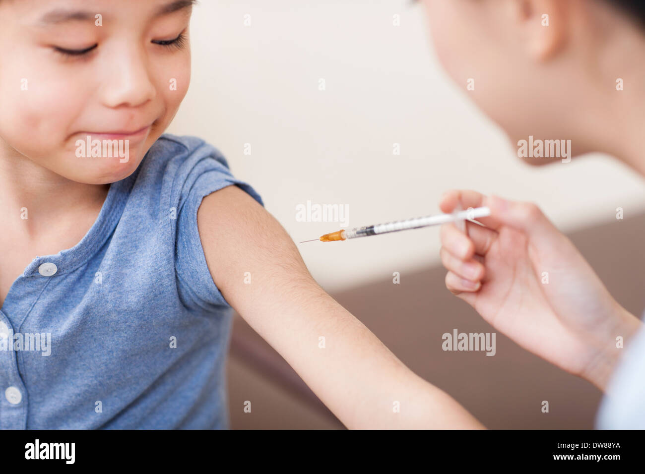 Nurse giving boy injection Stock Photo - Alamy