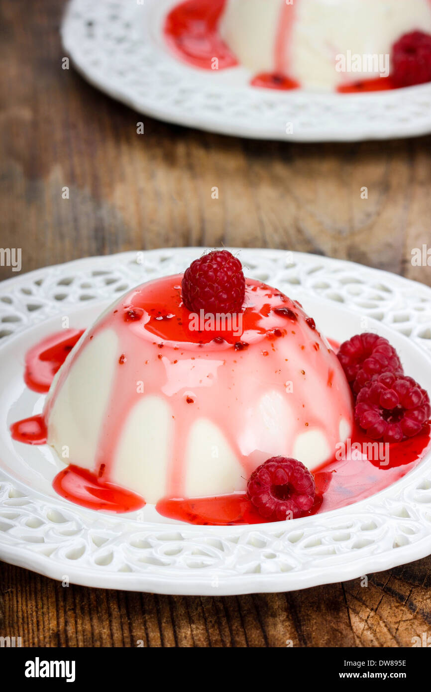 Flan with raspberry sauce and fresh fruitsFlan with raspberry sauce and ...