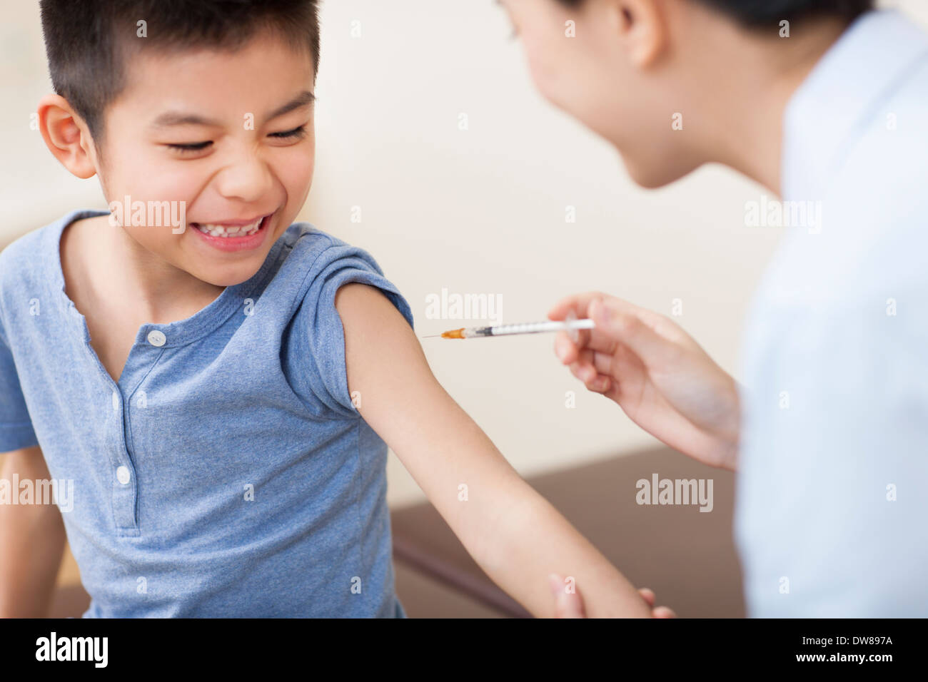 Nurse giving boy injection Stock Photo - Alamy