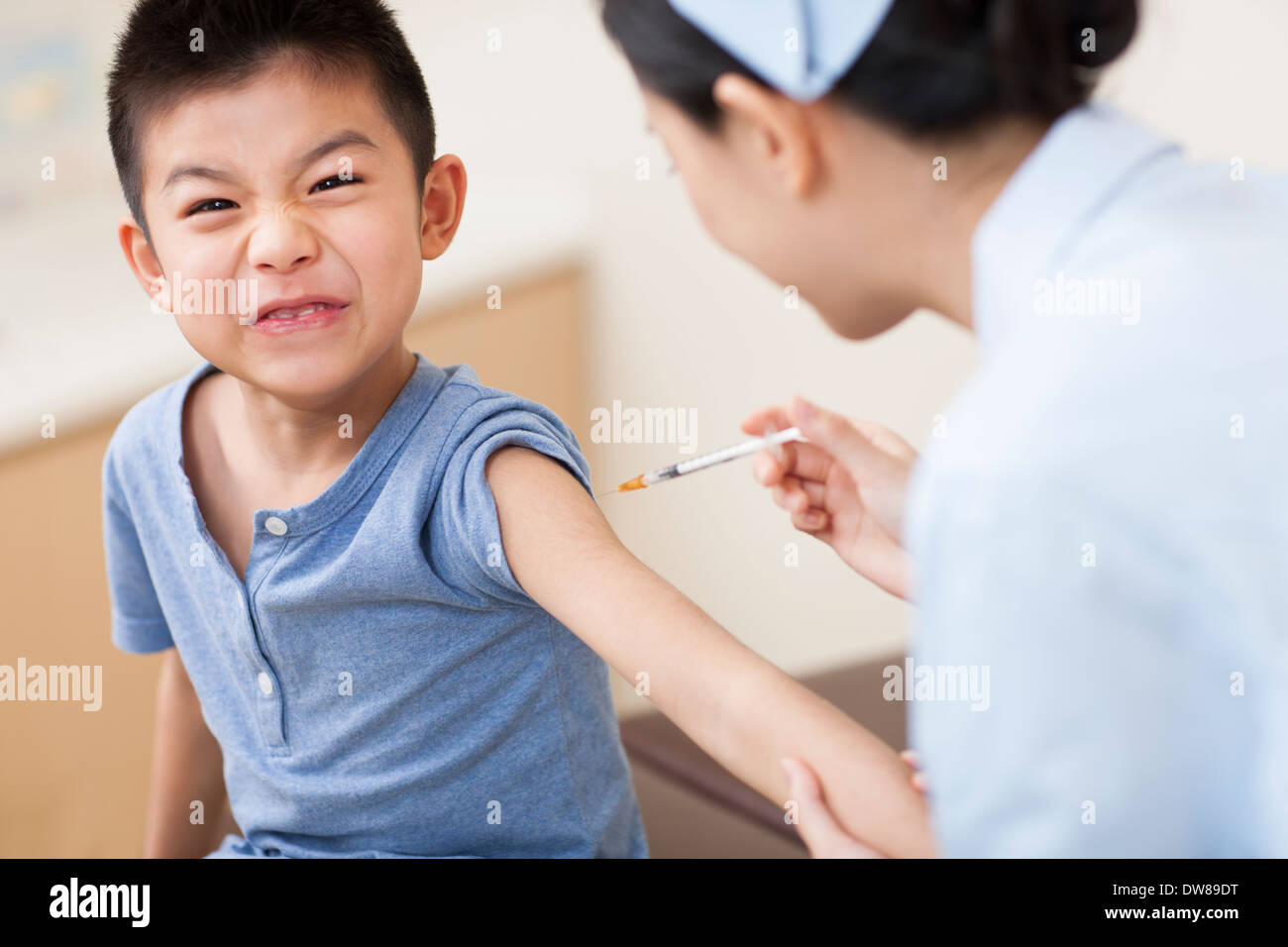 Nurse giving boy injection hi-res stock photography and images - Alamy