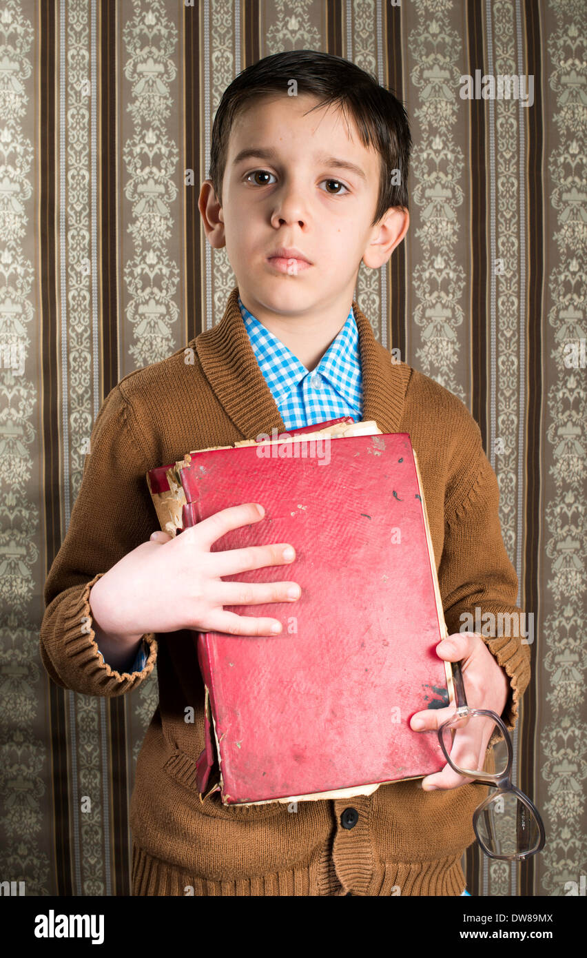 Child with red vintage book. Vintage clothes Stock Photo - Alamy