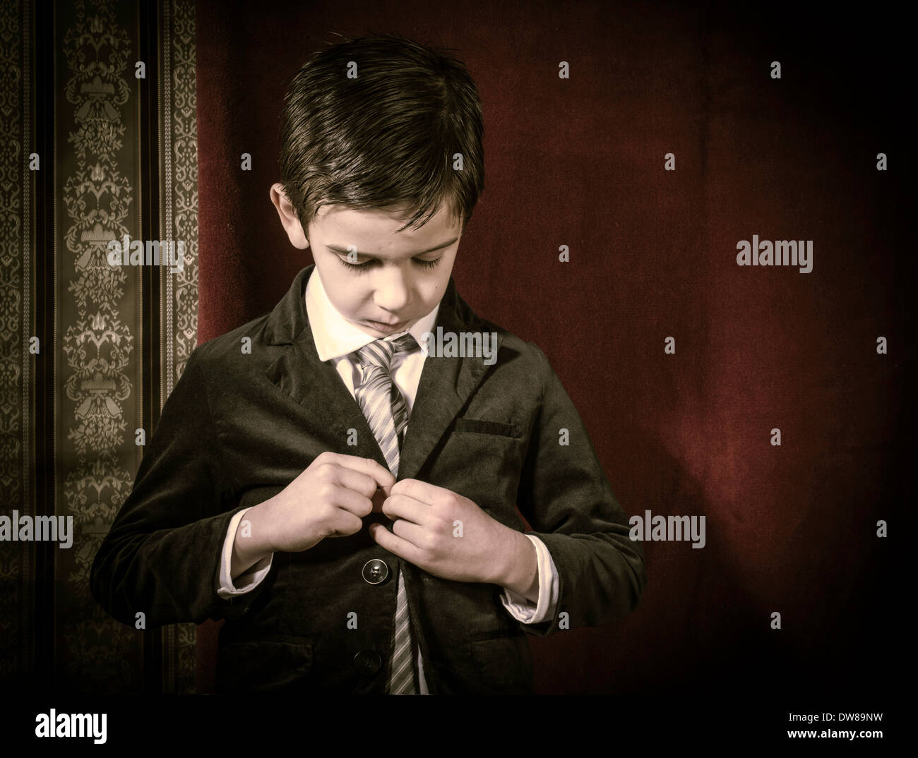 Boy in vintage black suit and tie Stock Photo - Alamy