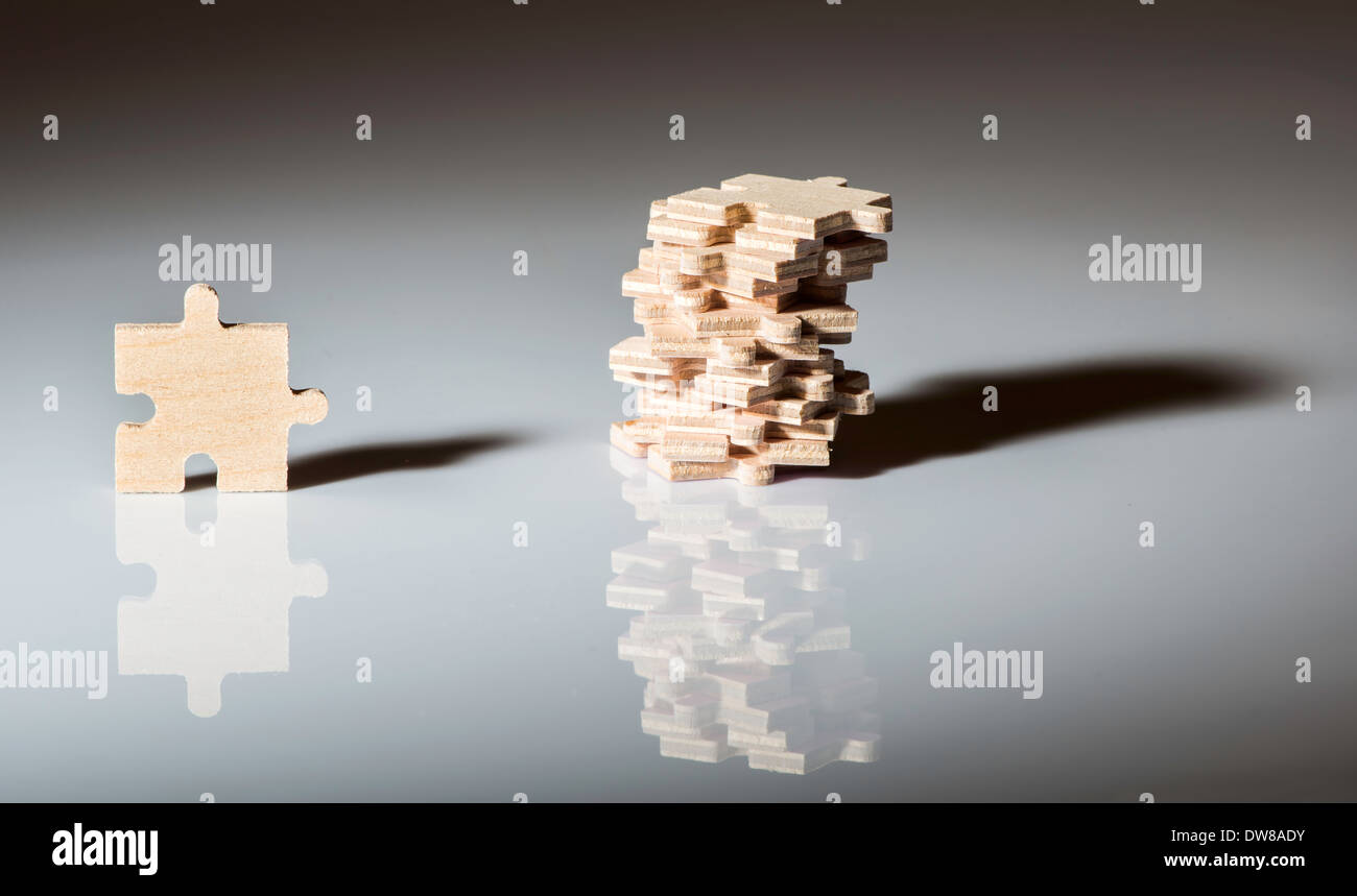 Wooden puzzle on white background. Pile of puzzle Stock Photo - Alamy