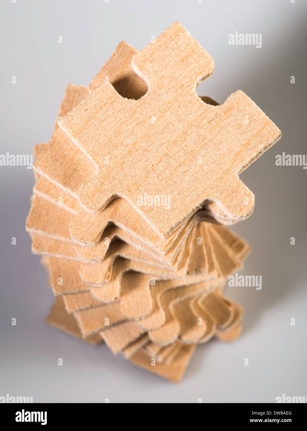 Wooden puzzle on white background. Pile of puzzle Stock Photo - Alamy