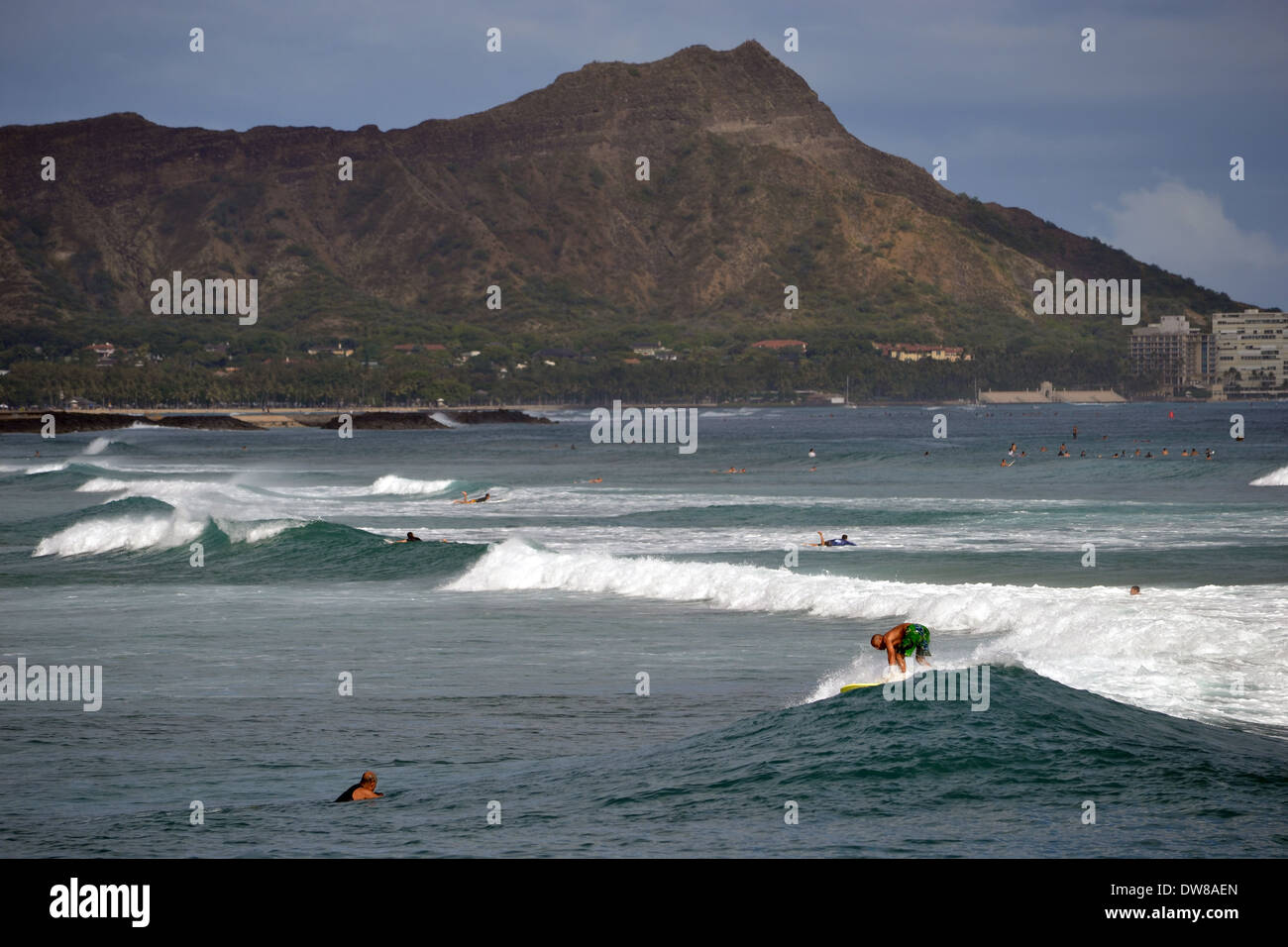 Surfing at Bowl's with view to Diamond Head, Waikiki Beach, Oahu ...