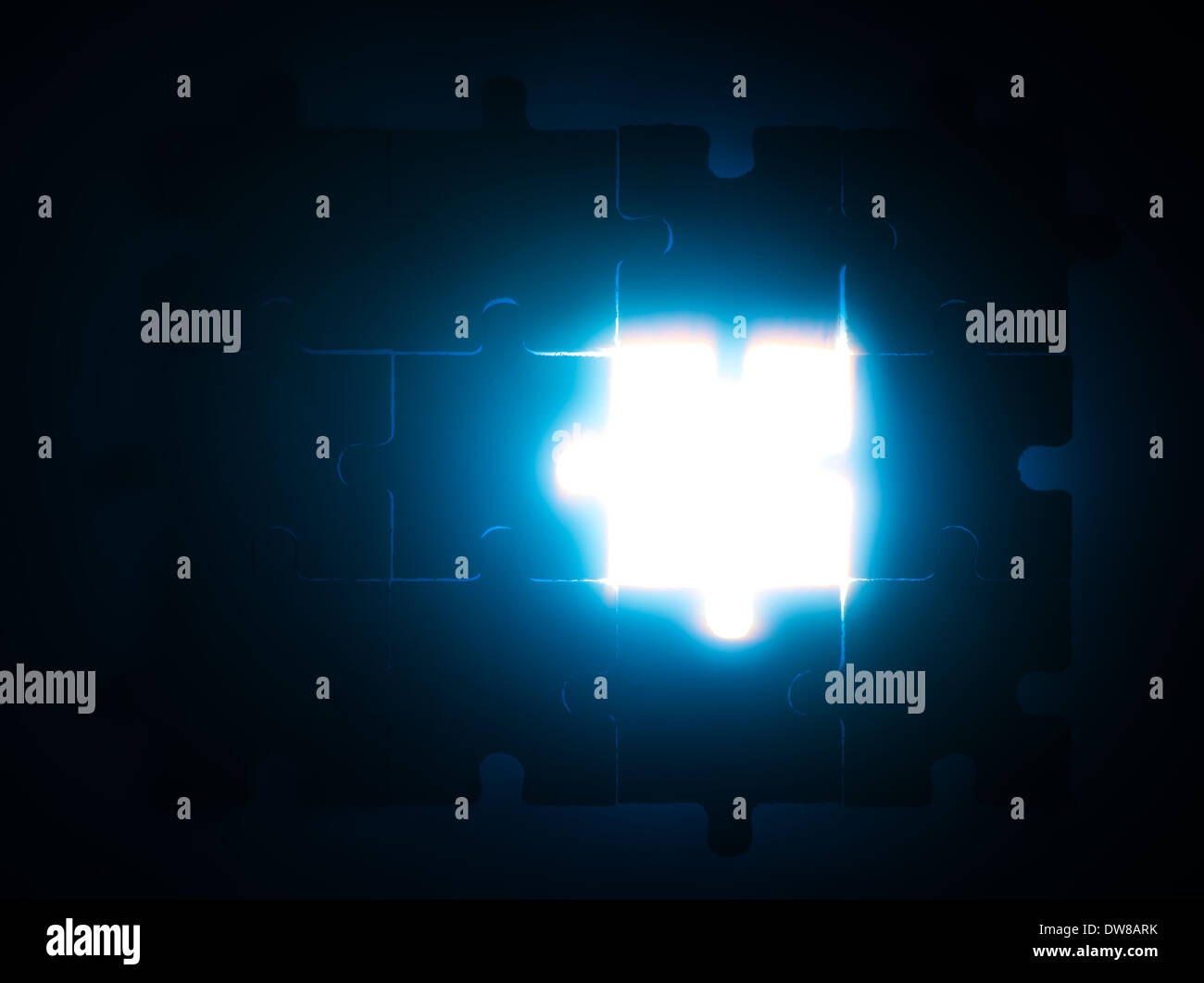 Wooden puzzle and backlight background. Close up. Blue color light ...