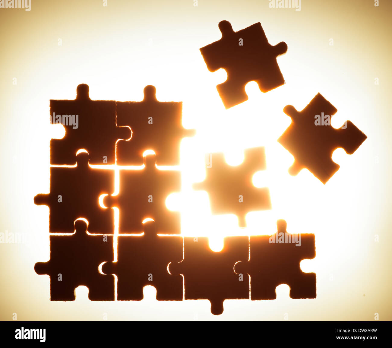 Wooden puzzle and backlight background. Close up Stock Photo - Alamy
