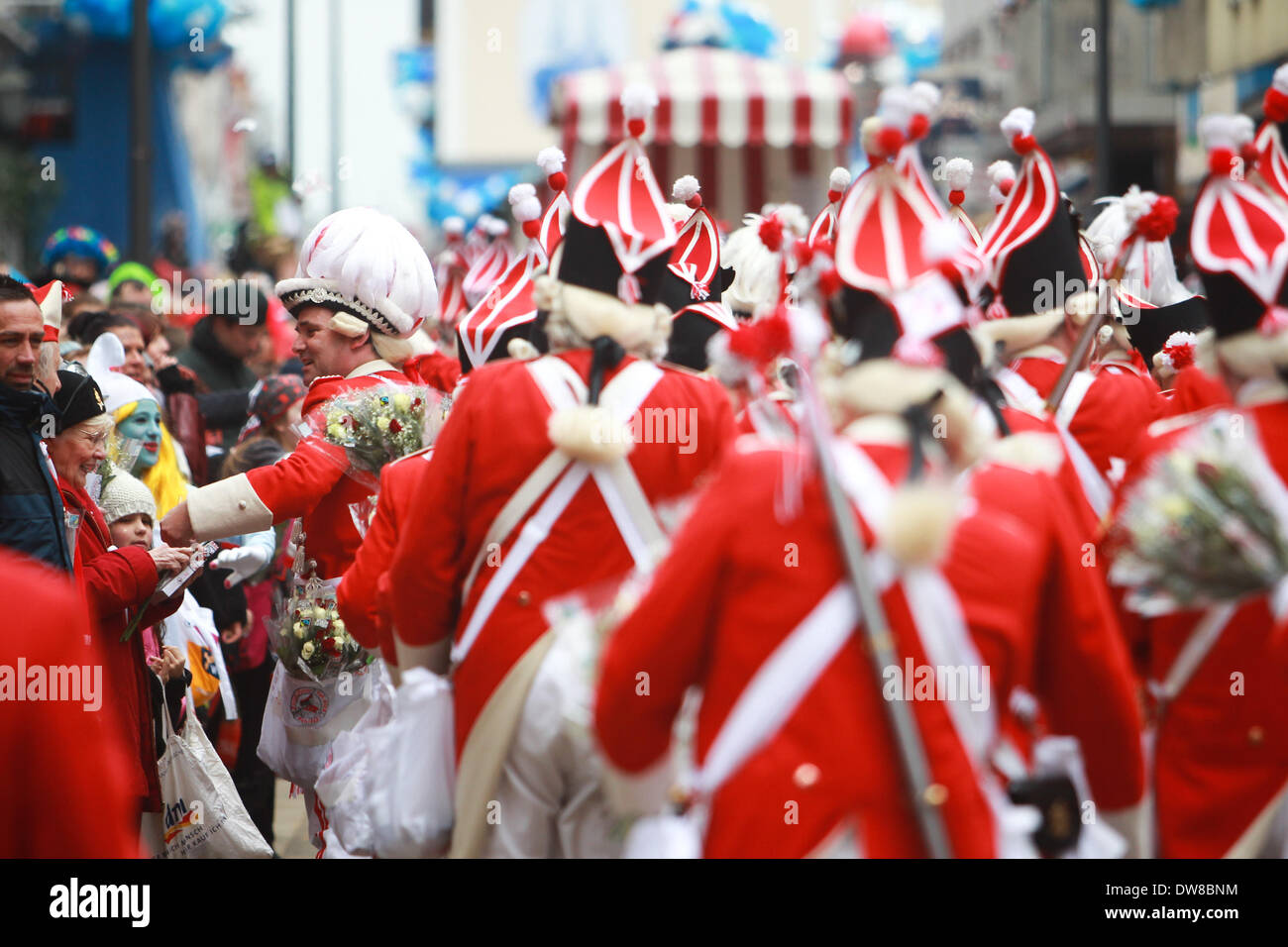 Cologne, Germany. 3rd Mar, 2014. Revelers in traditional costumes ...