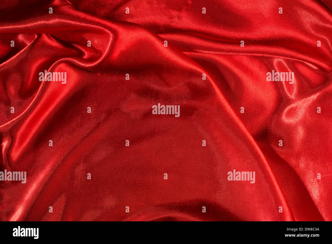 Shiny red satin pleated fabric background. Close up Stock Photo - Alamy