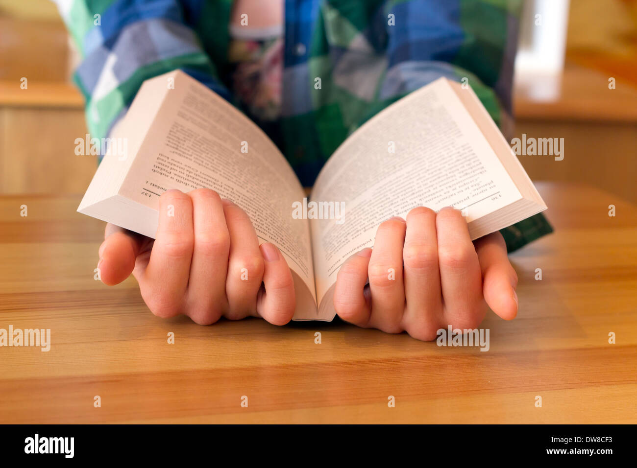Reading a book Stock Photo - Alamy