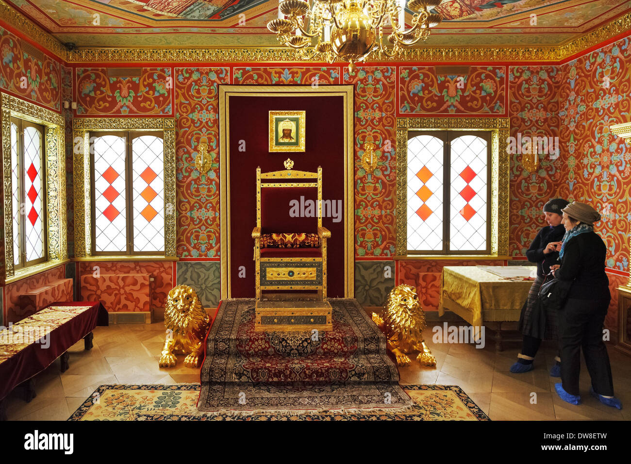 Tourists look at tsar throne in room of Great Wooden Palace of Tsar ...