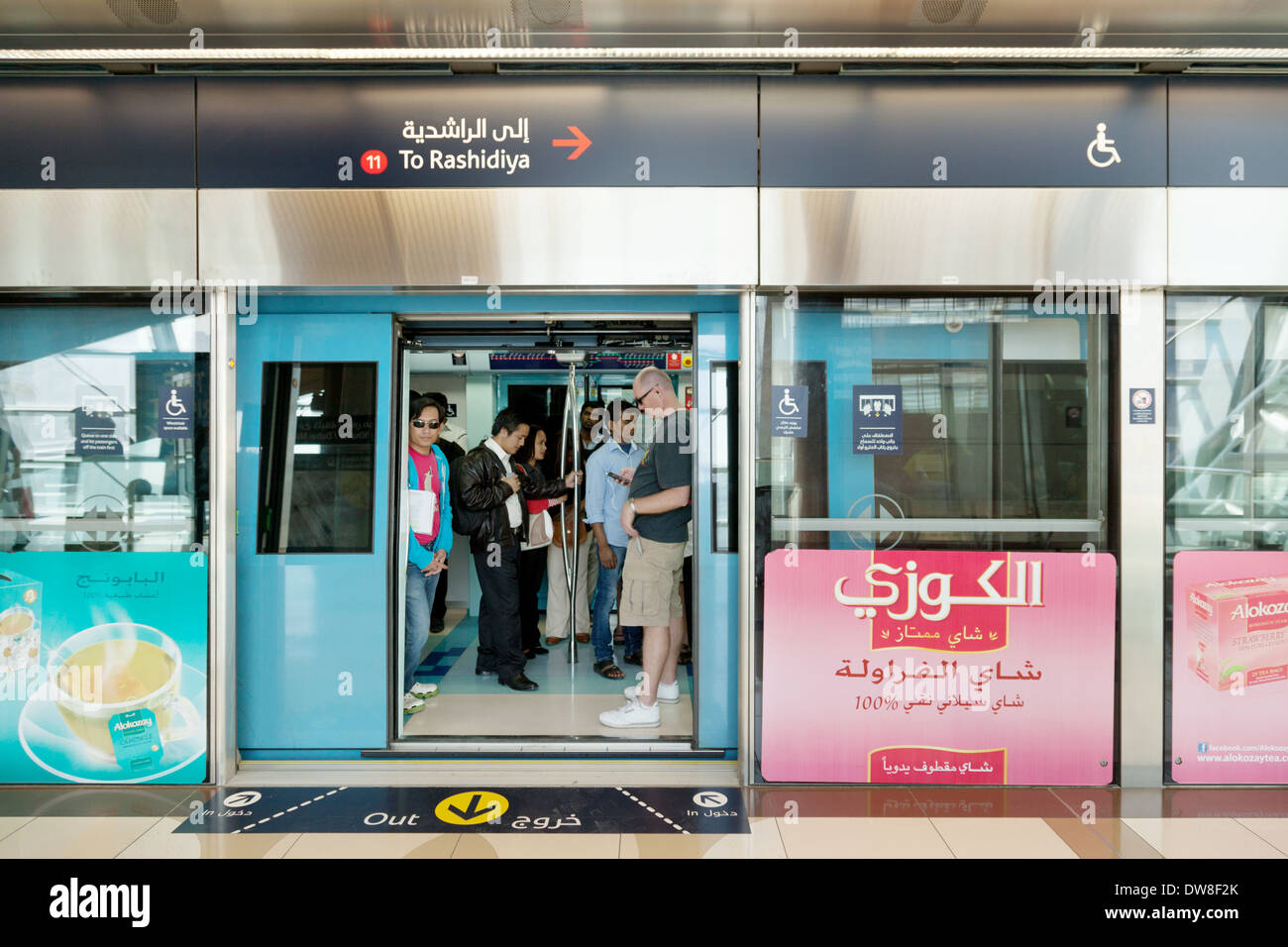 Dubai Metro public transport system - passengers on a train seen from ...