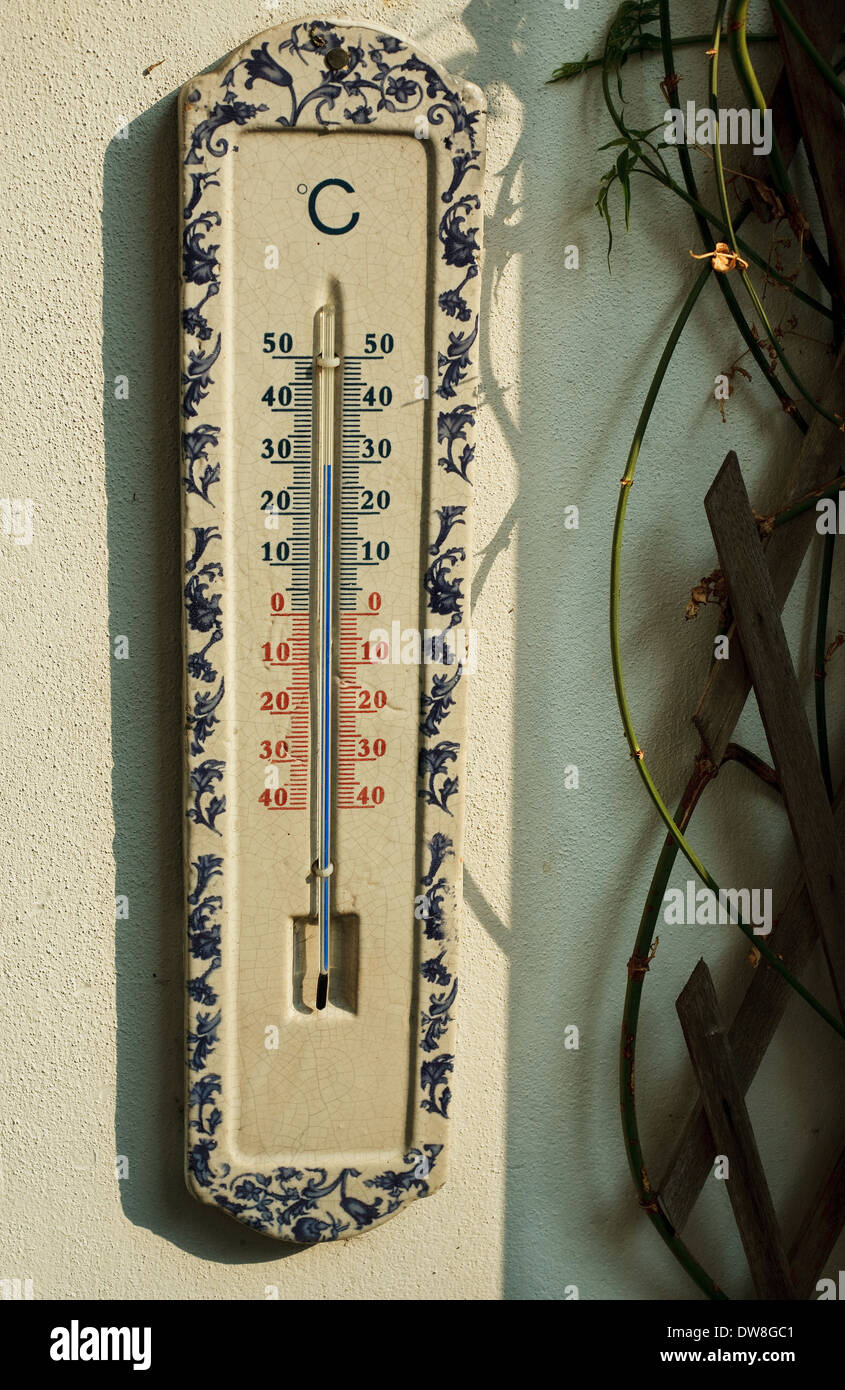 Outside ceramic wall thermometer 30 degrees centigrade Stock Photo - Alamy