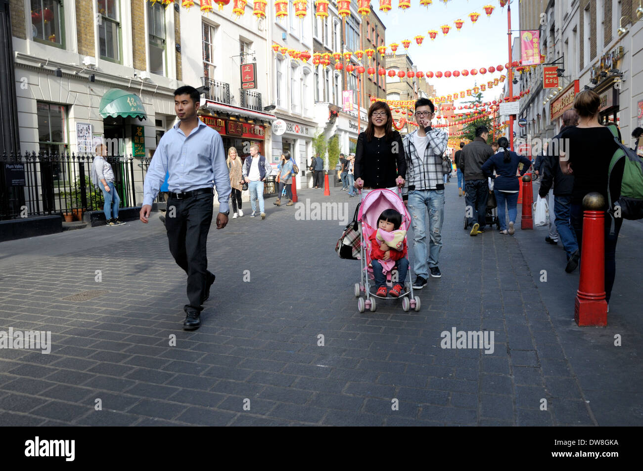 London, England, UK. Young Chinese family in Gerrard Street, Chinatown ...