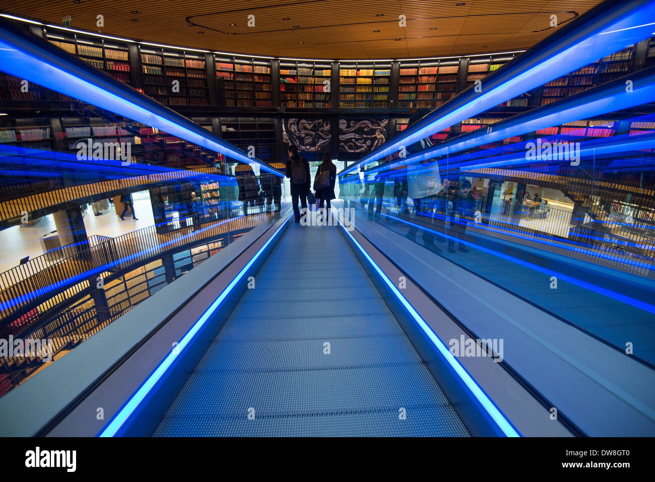 People traveling on an escalator inside the new library building in ...
