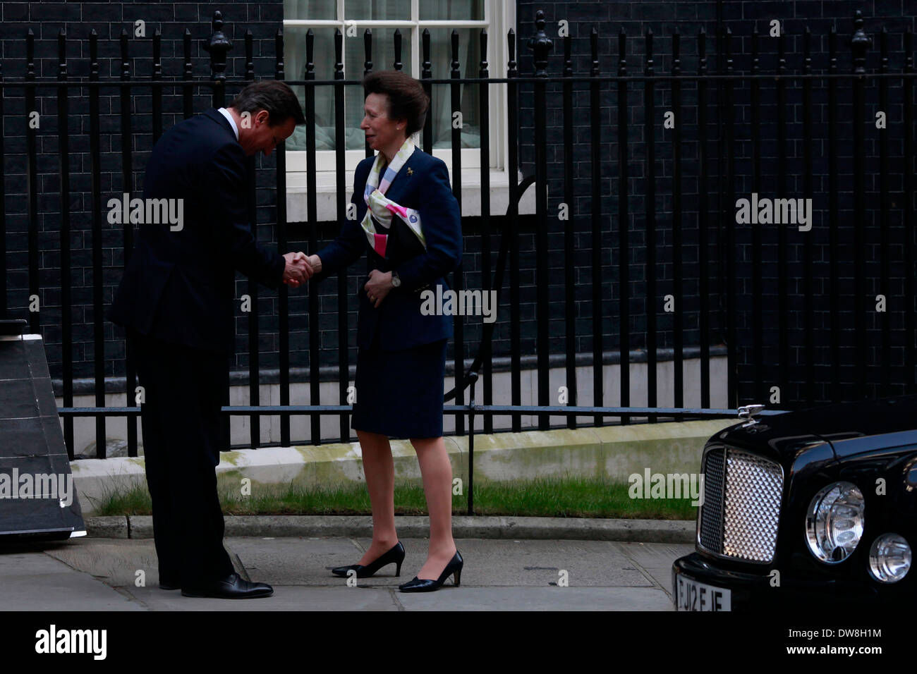 Prime Minister David Cameron walks out of Downing Street to pose for ...
