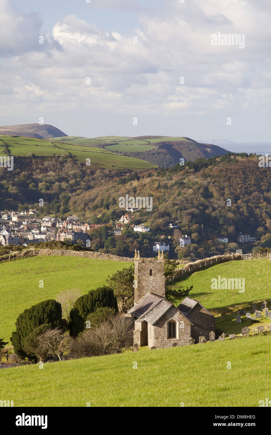 View of church village woodland and coastline on sunny morning Church ...