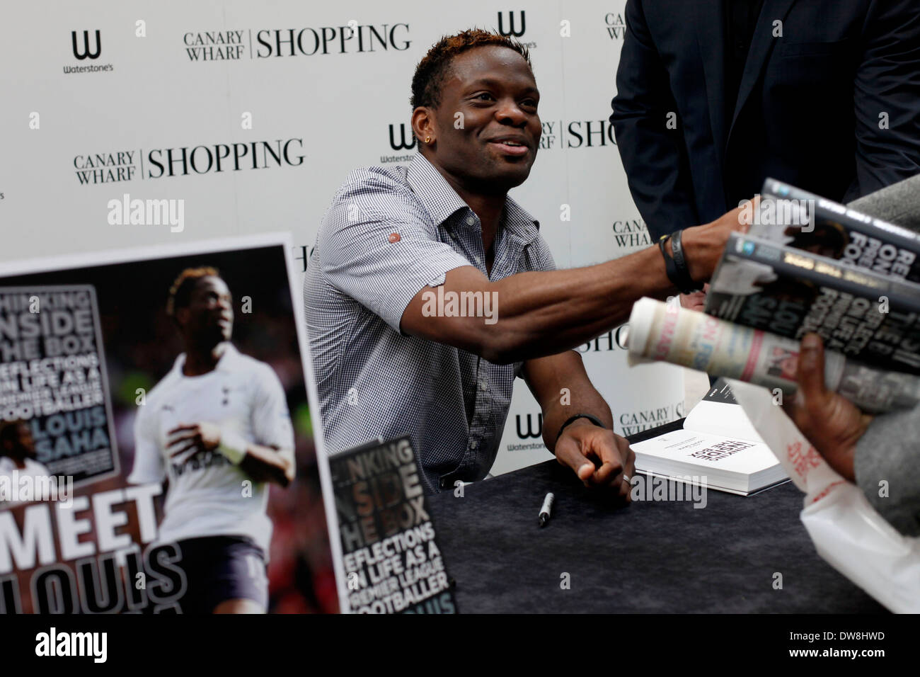 Louis Saha Tottenham Hotspur's footballer signs copies of his new ...