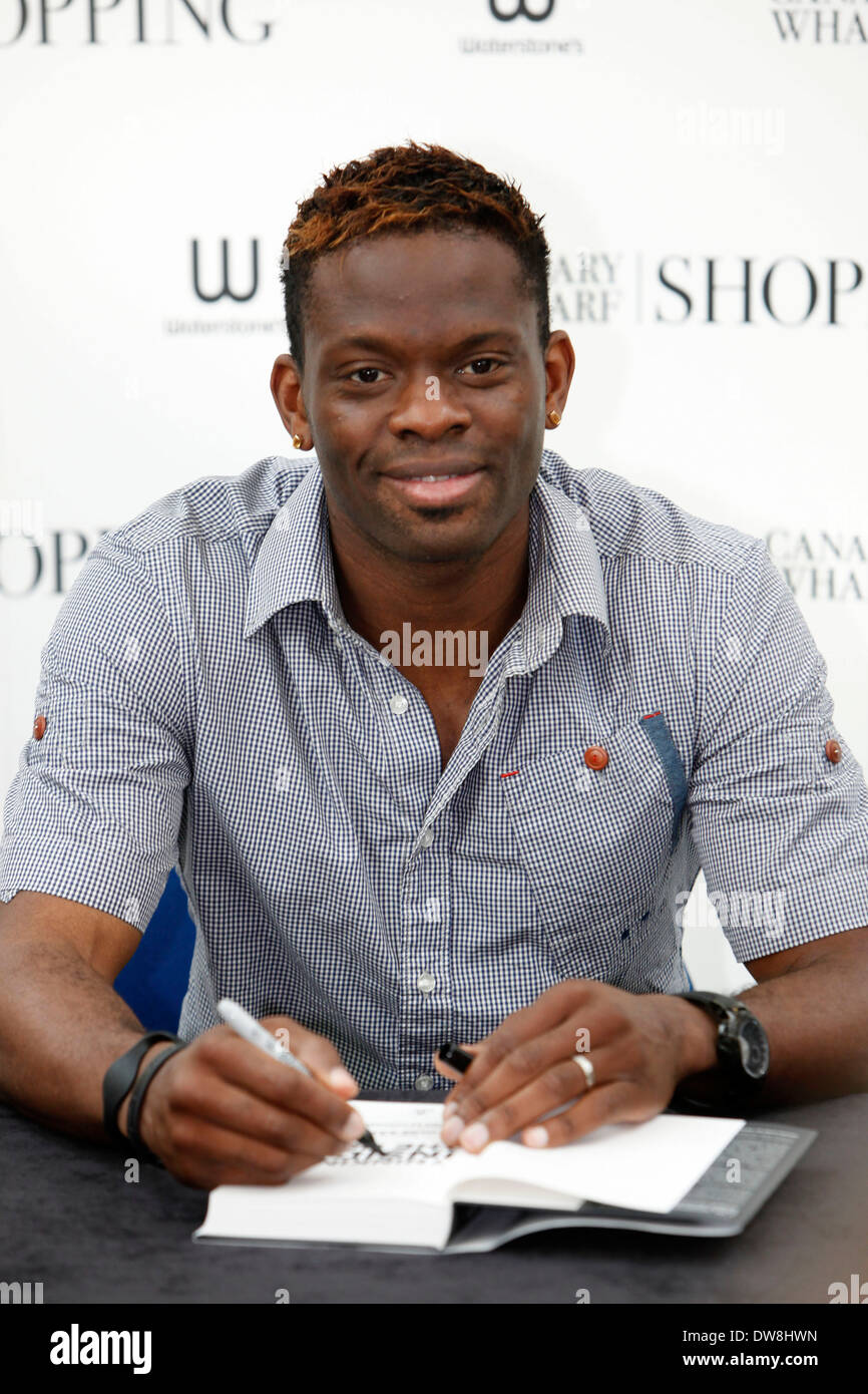 Louis Saha Tottenham Hotspur's footballer signs copies of his new ...