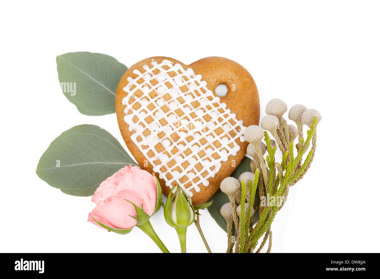 Romantic gift: Ginger heart-shaped cookie with flowers isolated on ...