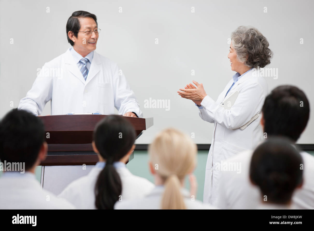 Medical workers clapping in a meeting hi-res stock photography and ...