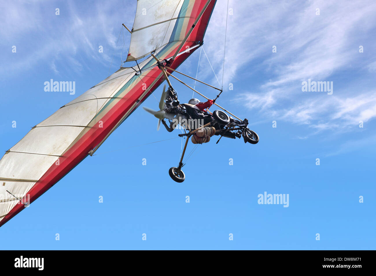 The motorized hang glider in the blue sky Stock Photo - Alamy