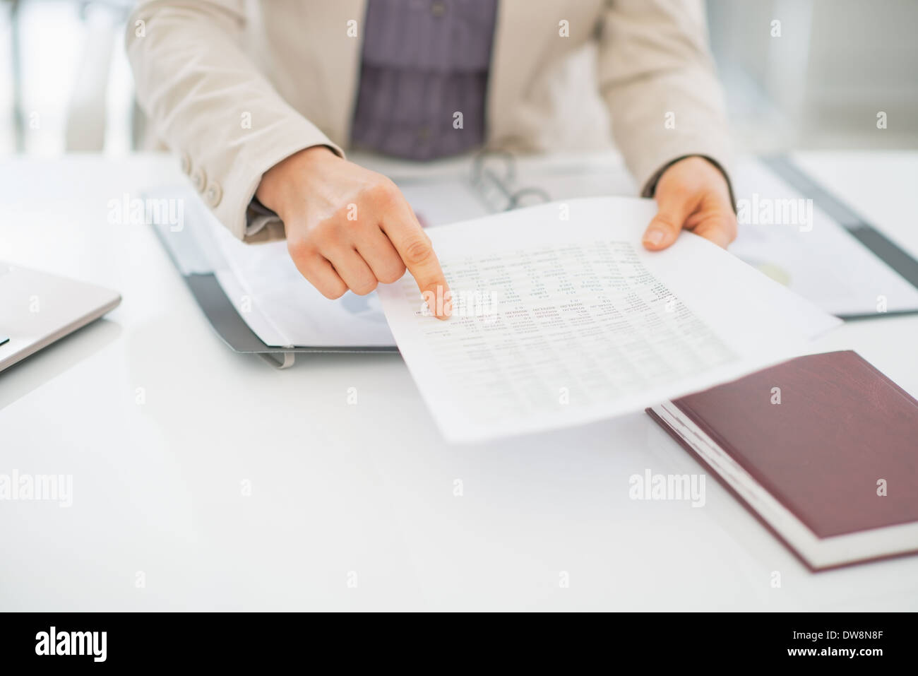 Closeup on business woman pointing on document Stock Photo - Alamy