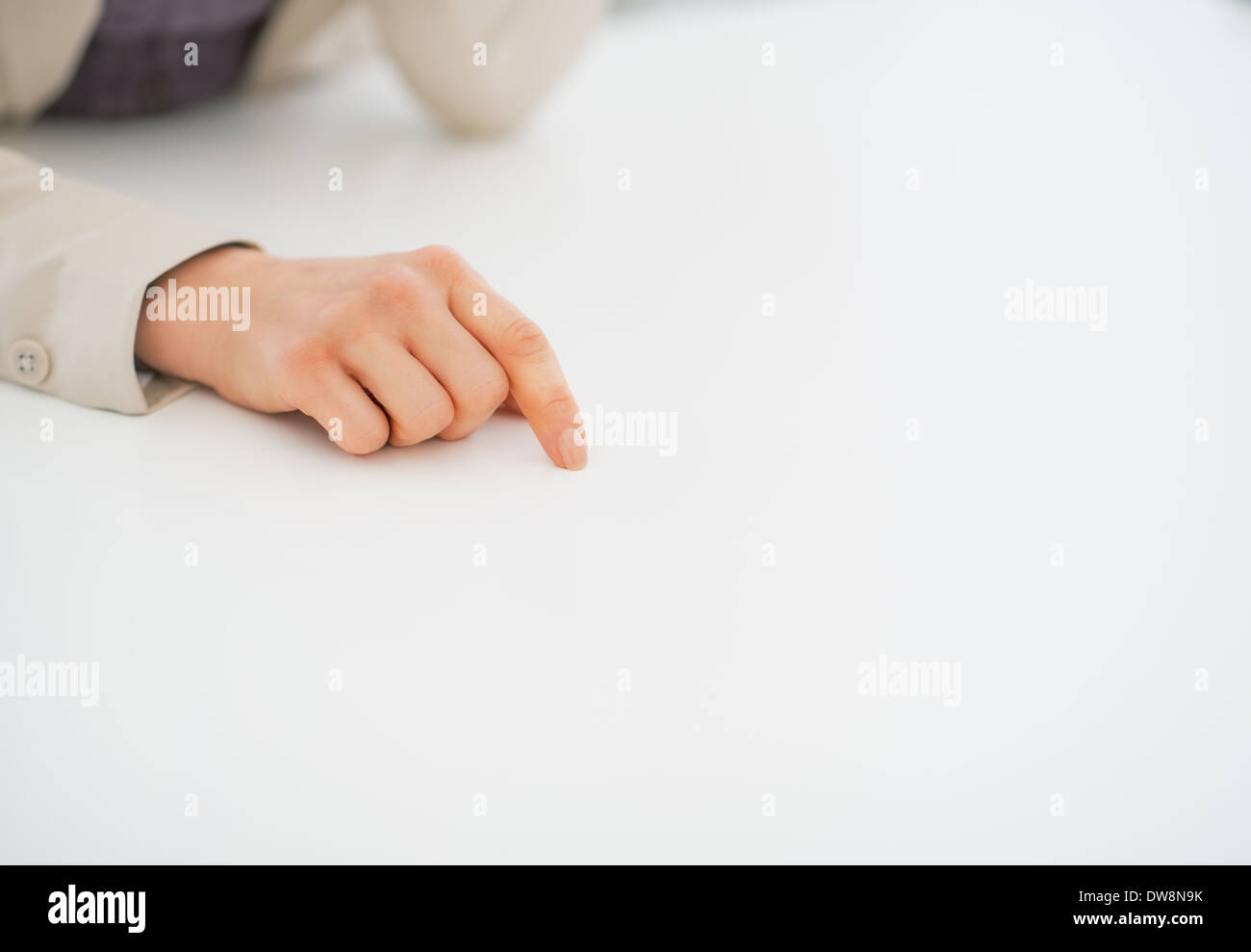 Closeup on business woman pointing on desk Stock Photo - Alamy