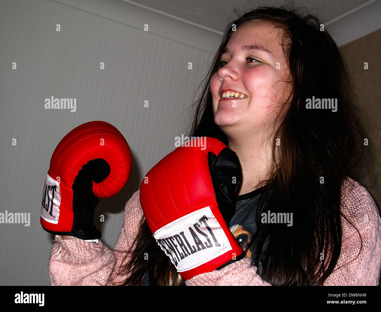 12 year old girl playing with Everlast boxing gloves Stock Photo - Alamy