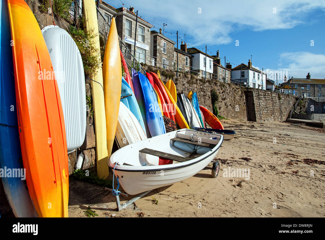 kayaks on the beach mousehole in cornwall, uk Stock Photo - Alamy