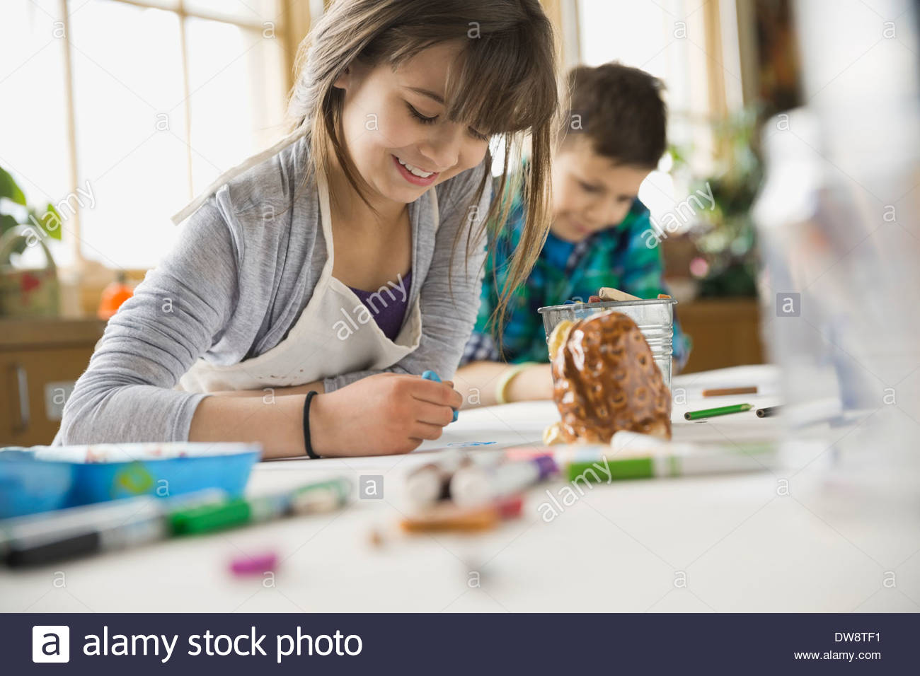 Girl child holding drawing art class hi-res stock photography and ...