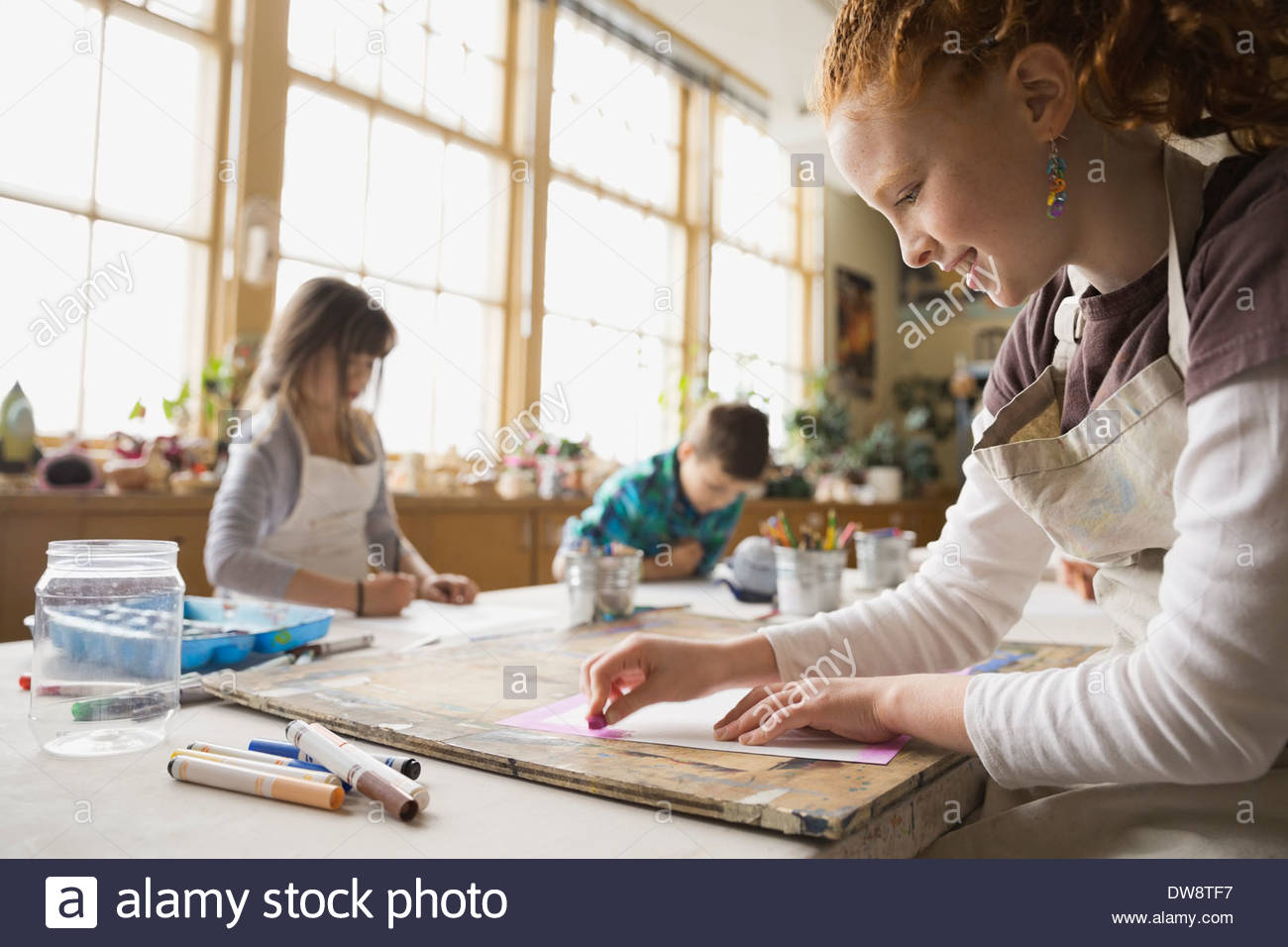 Girl drawing with pastels in art class hi-res stock photography and ...