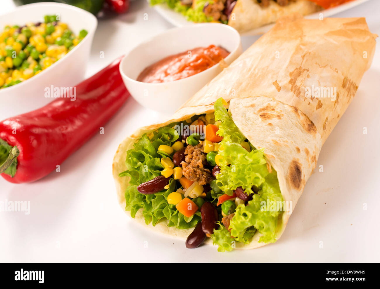 Big wrap sandwich with beef and vegetables.Selective focus in the ...