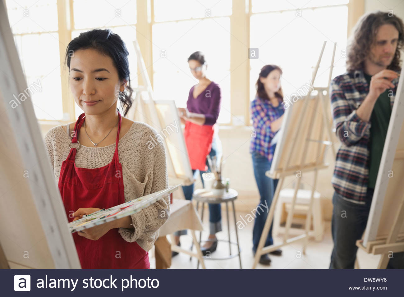 Female painting artist apron hi-res stock photography and images - Alamy