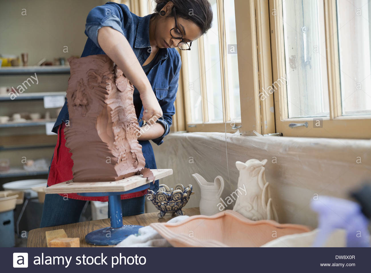 Female student working on clay hi-res stock photography and images - Alamy