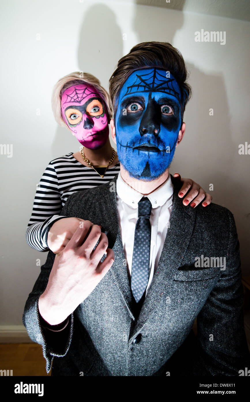 Attractive young couple with horror style face paint on white Stock ...
