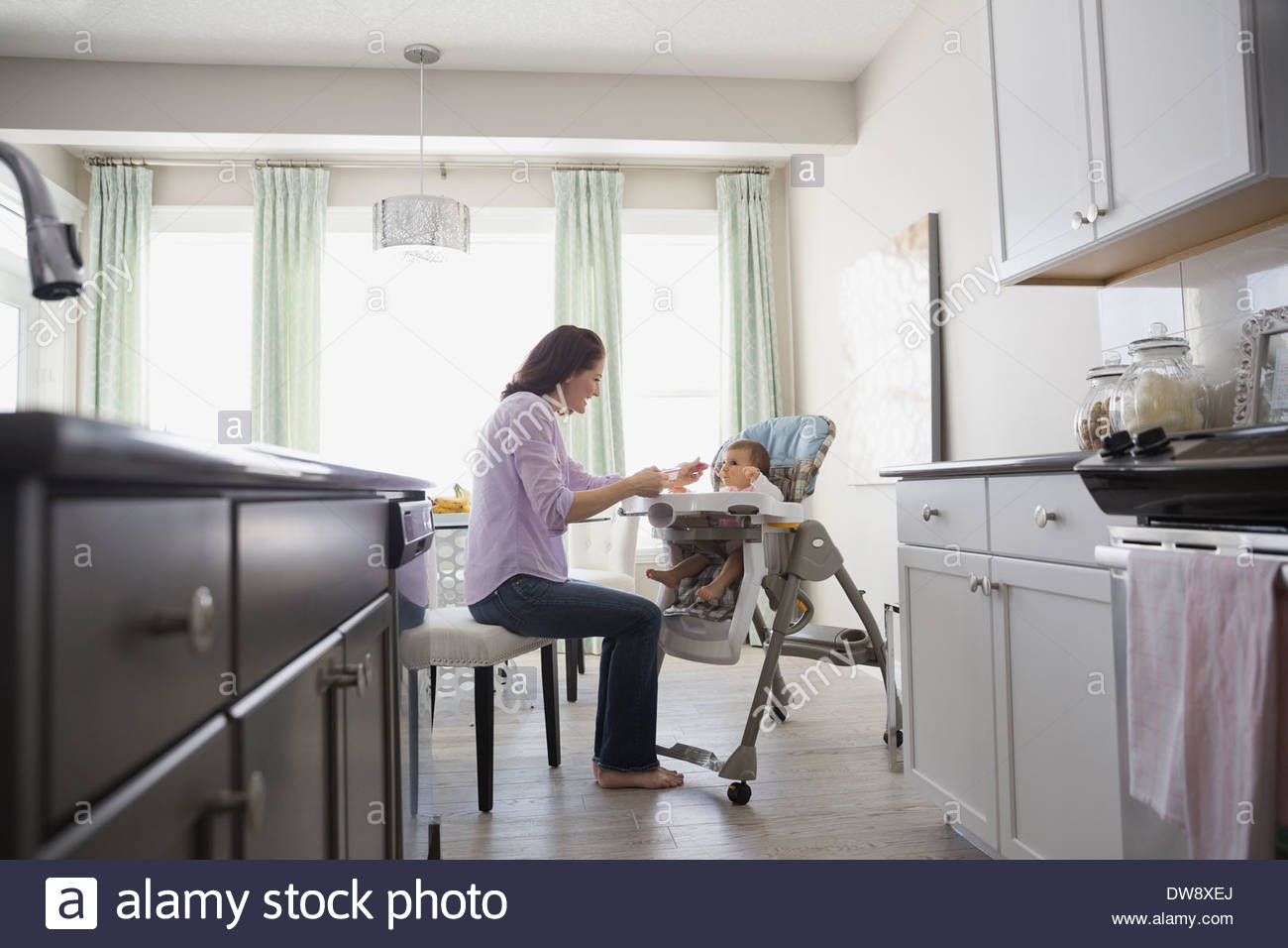 Feeding baby girl hi-res stock photography and images - Alamy